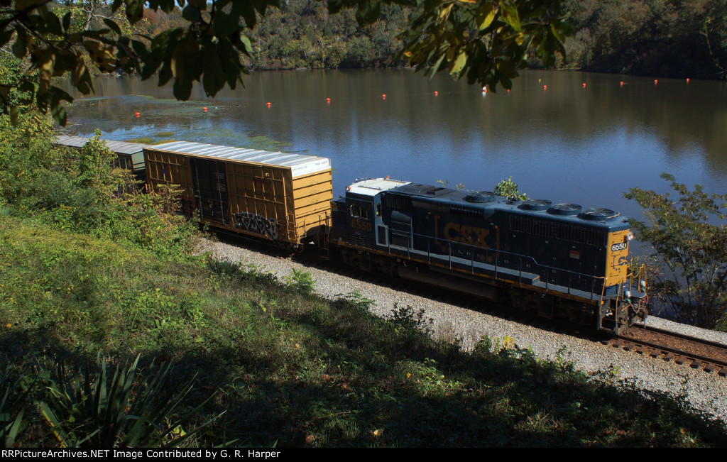 CSX 6550 long hood forward eastbound with local H74414